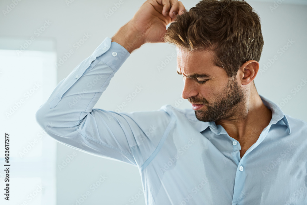 Shirt, stress with man smelling armpit sweat stain and indoors at his ...