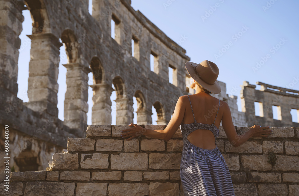 Beautiful tourist woman visiting the sights in Pula, Croatia. Vacation ...