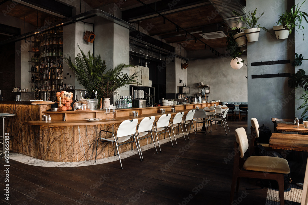 Modern interior in cafe with bar and chairs with concrete walls and ...