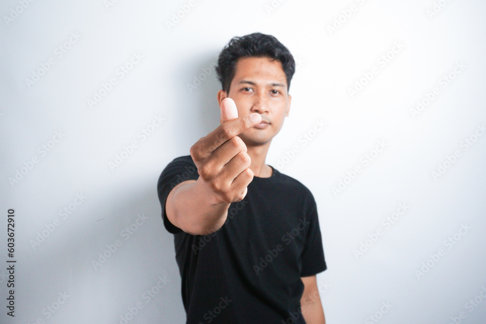 Handsome Asian young man giving Korean love sign. The Korean symbol for ...