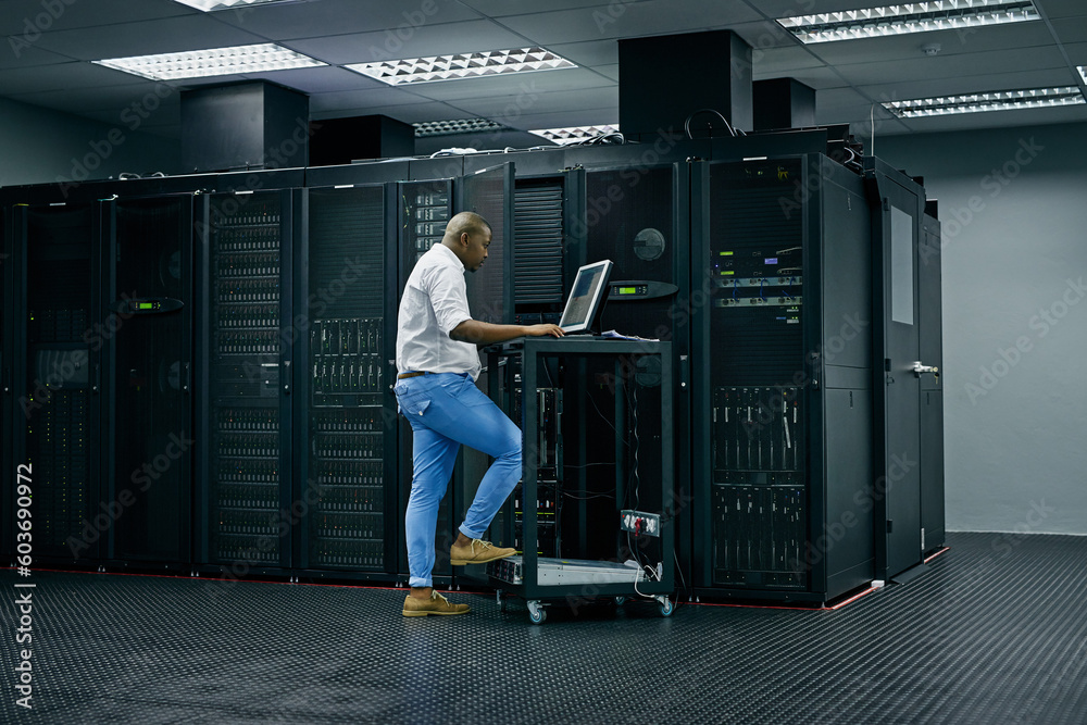 Server room, database and information technology with an engineer man ...