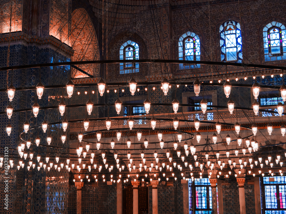 Mosque inside. A large central chandelier, located just below the dome ...