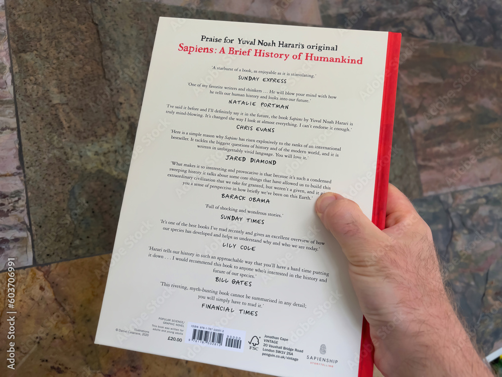 Paris, France - Apr 23, 2023: A male hand holds the best-selling book ...