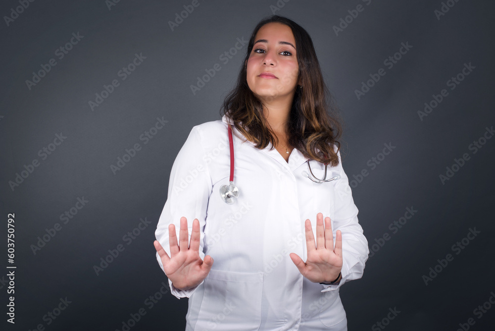 Beautiful brunette girl over isolated background afraid and terrified ...