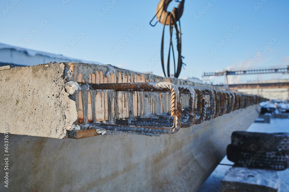 Row of reinforced concrete foundations with metal anchor bolts designed ...
