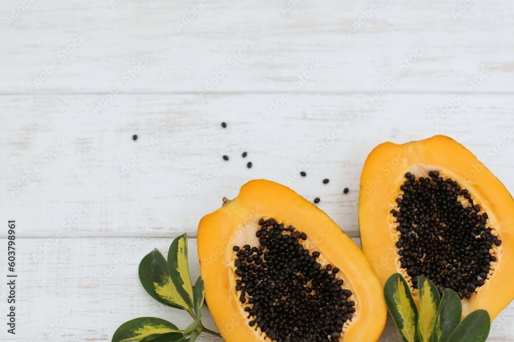Cut papaya fruit, on a white table, background, background image ...