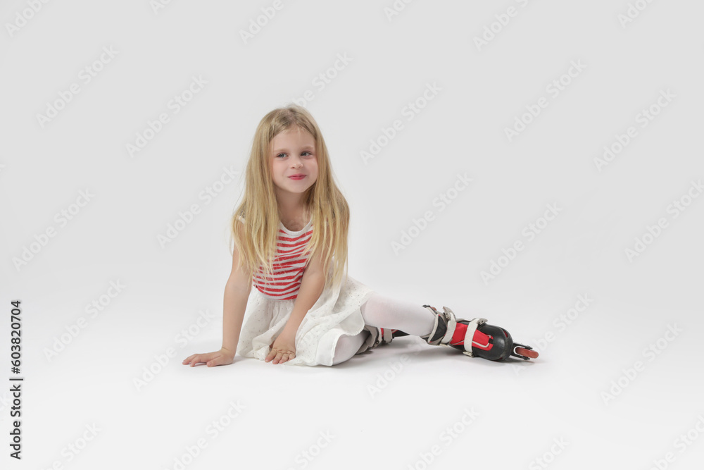 Studio portrait of beautiful bonde little girl in roller blades Stock ...