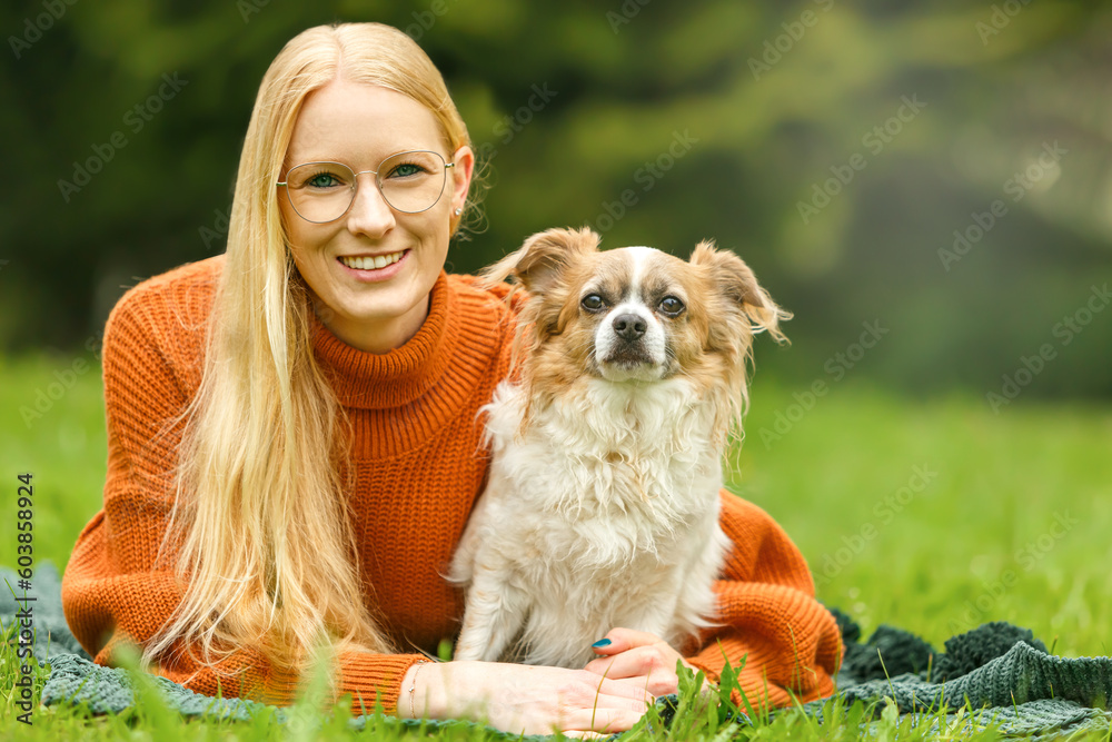 Foto de Female dog owner concept: Portrait of a young woman spending ...