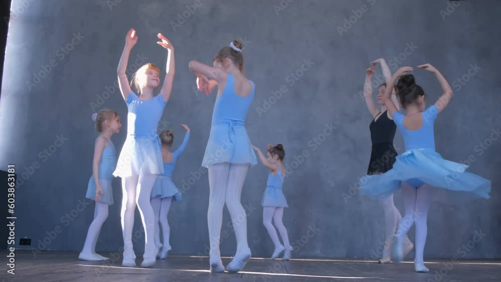 4k Group of teen girls practicing various dance moves with instructor ...