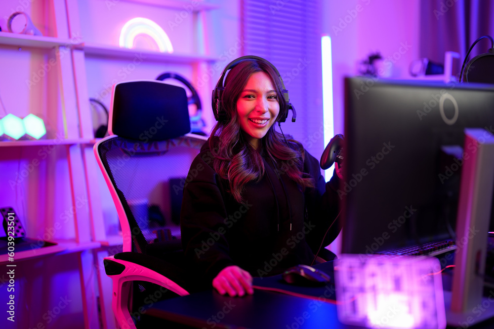Asian pretty streamer girl smile and hold controller for game battle ...