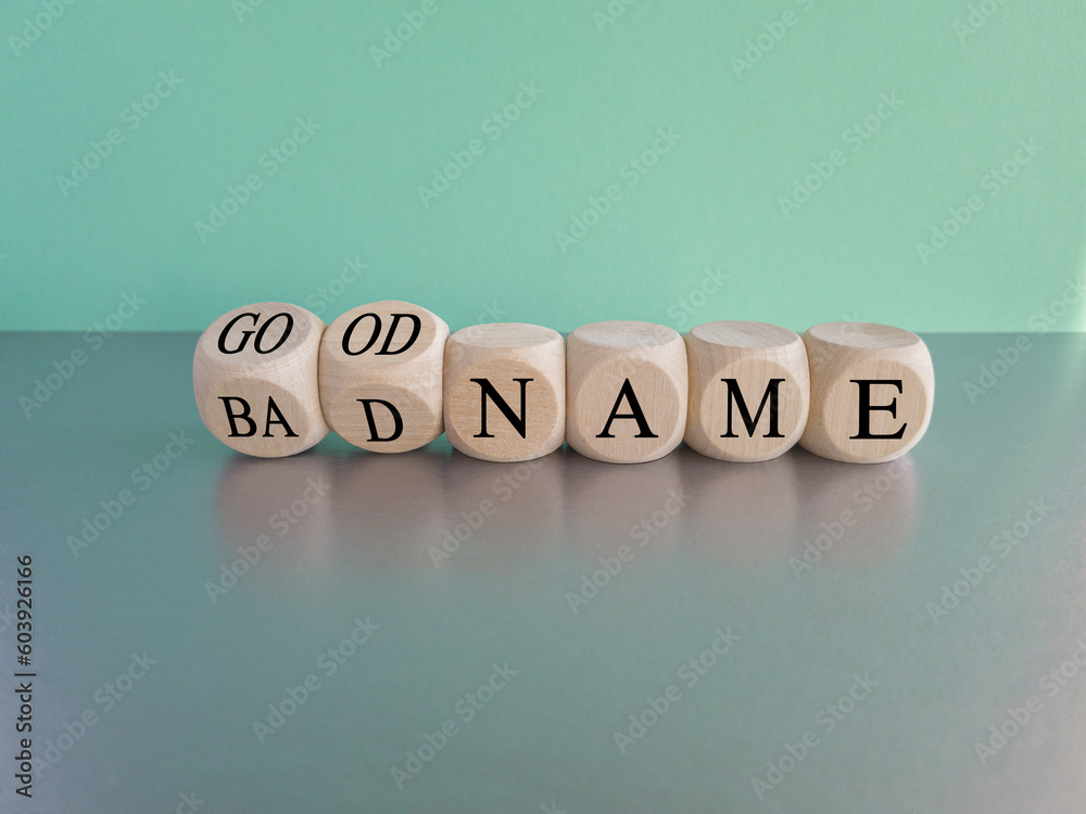Good or bad name symbol. Turned wooden cubes and changes words 'bad ...