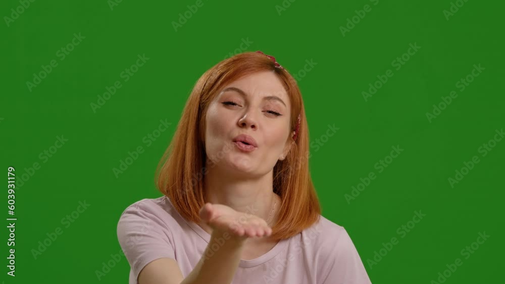Vidéo Stock Woman blowing kiss both hands on green screen background ...