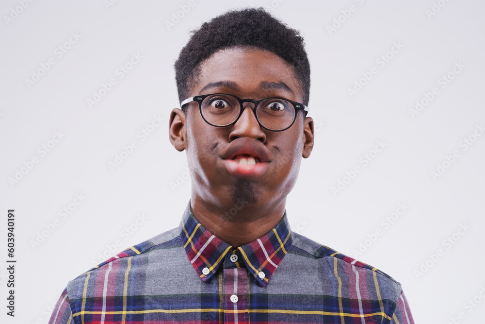 Funny face, comic and portrait of a black man being crazy isolated on a ...