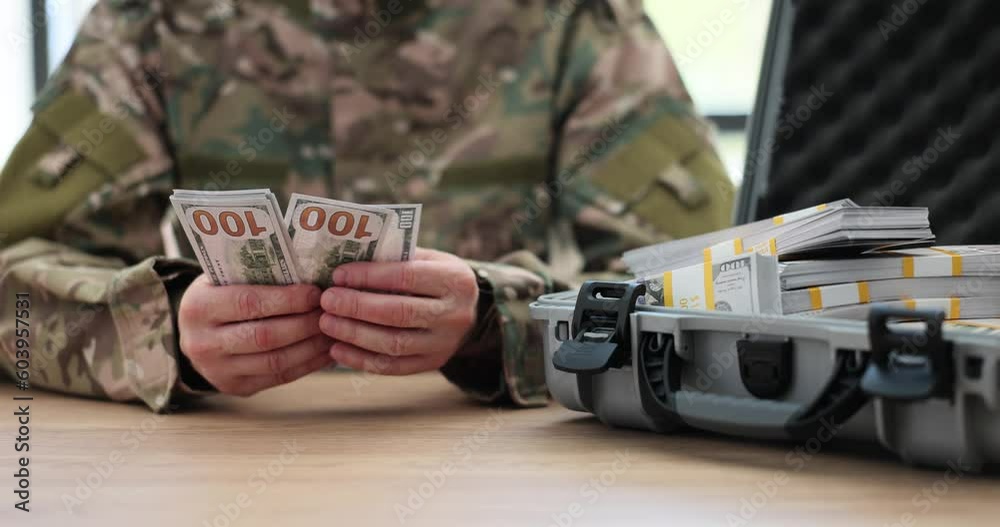 Army soldier counting million dollar money. Illegal earnings in war and ...