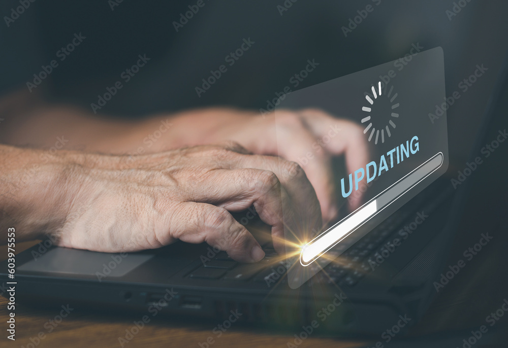 Businessman using desktop loading data with loading bar icon over a ...