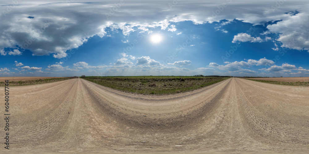 spherical 360 hdri panorama on edge of gravel road with clouds and sun ...