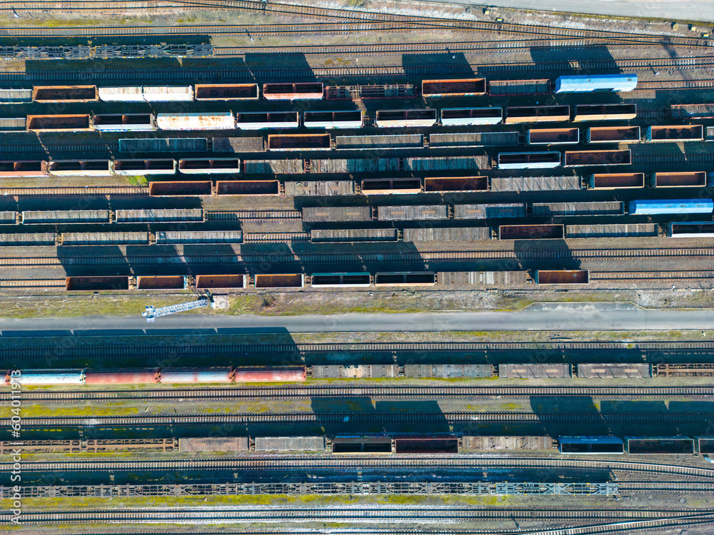 Cargo trains close-up. Aerial view of colorful freight trains on the ...