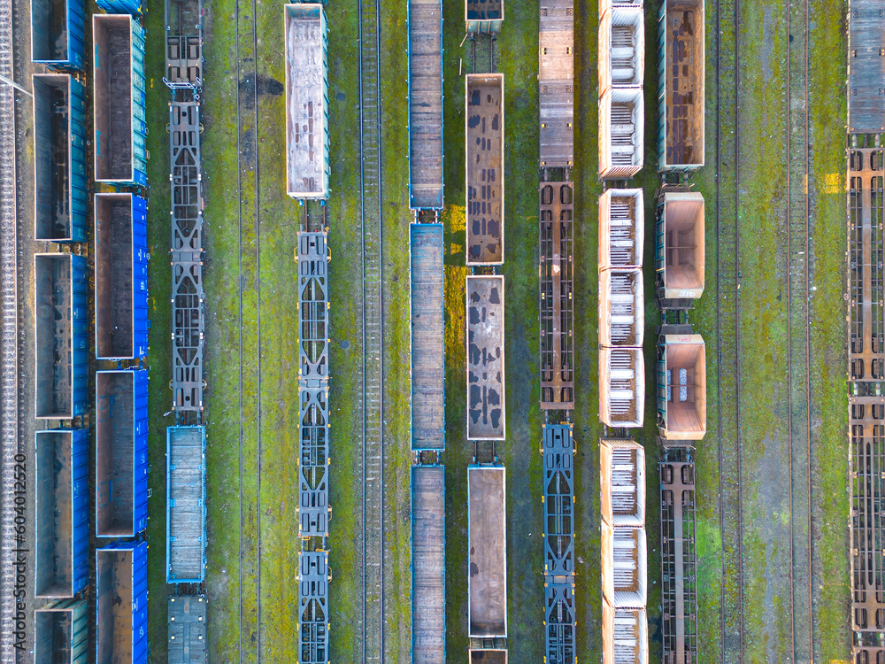 Cargo trains close-up. Aerial view of colorful freight trains on the ...