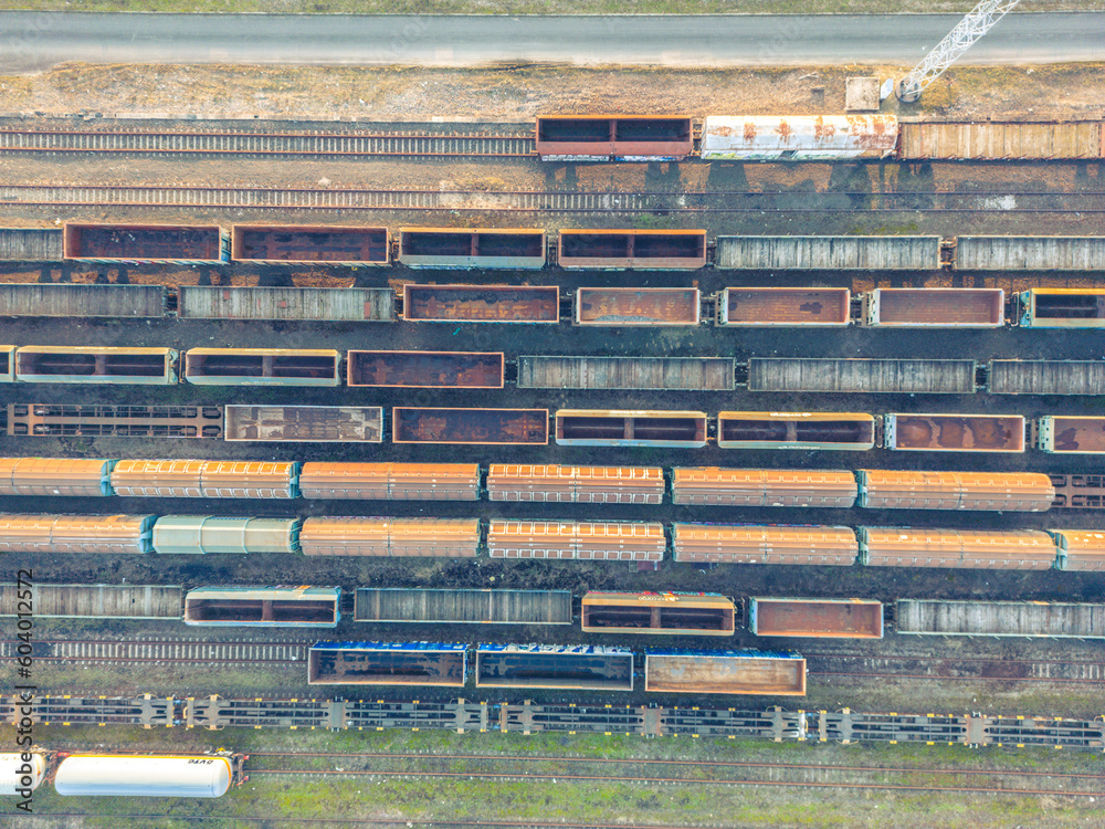 Cargo trains close-up. Aerial view of colorful freight trains on the ...