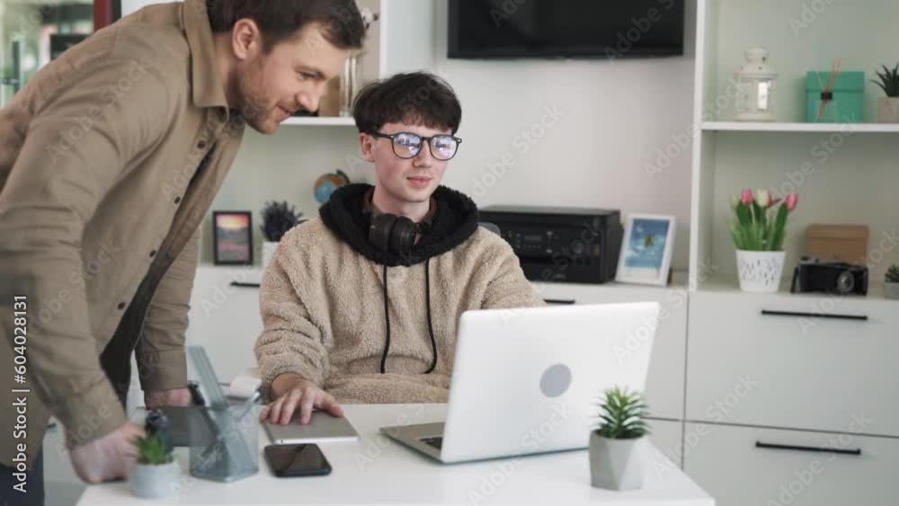 The supervisor approaches the employee in the office.The supervisor ...