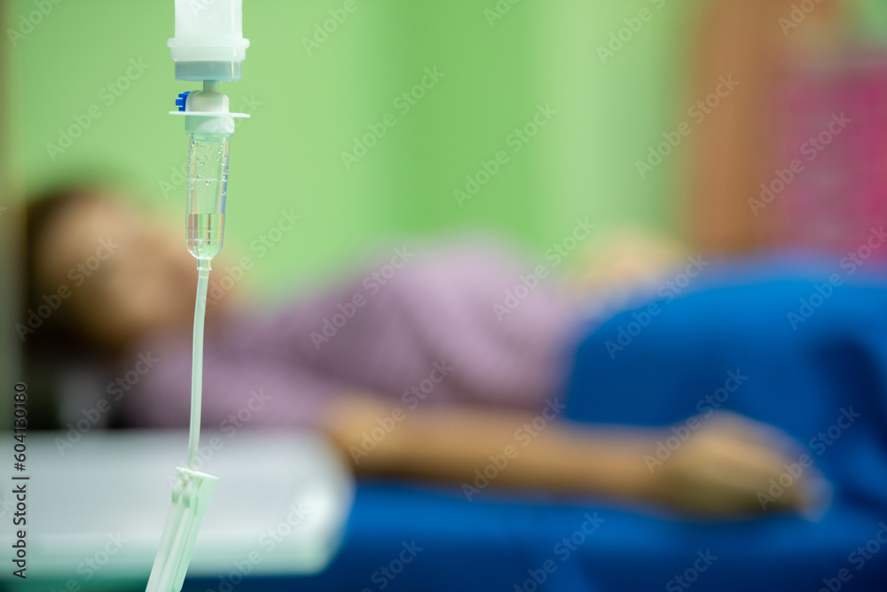 Woman doctor monitor Adjust the drip rate feed of saline dripping ...