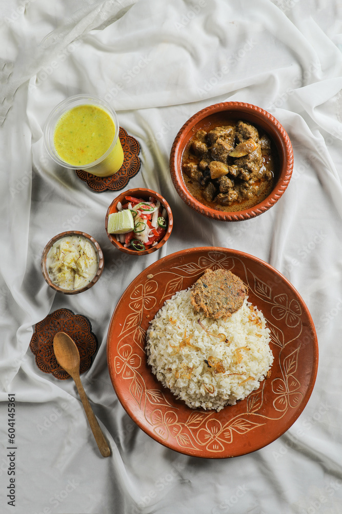 Shatkora Beef kacchi biryani khichuri with salad, borhani and Chui ...
