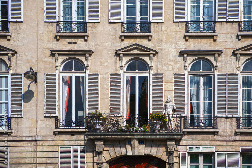 Digital photo of a Paris ancient stone building facade with three rows ...