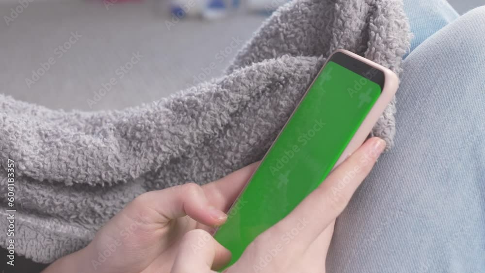Teenager girl typing on phone with green screen. Phone with greenscreen ...