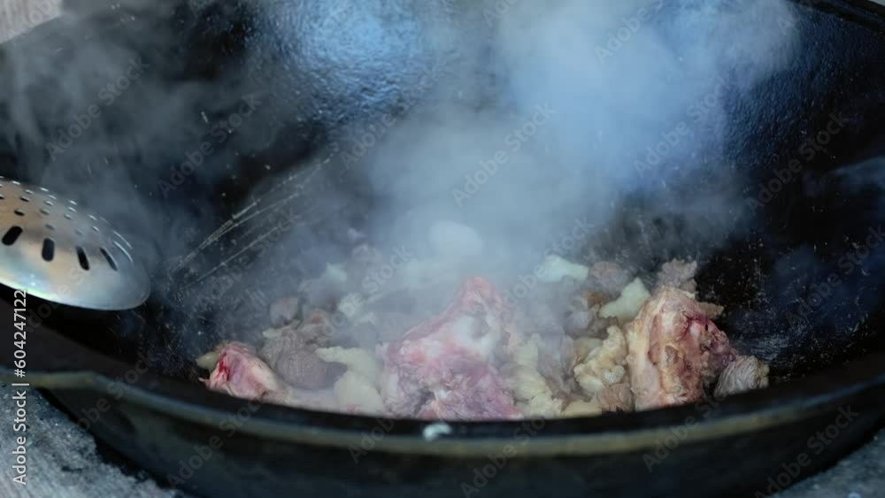 Mouth-watering video where a traditional pilaf dish is cooked. Cooking ...