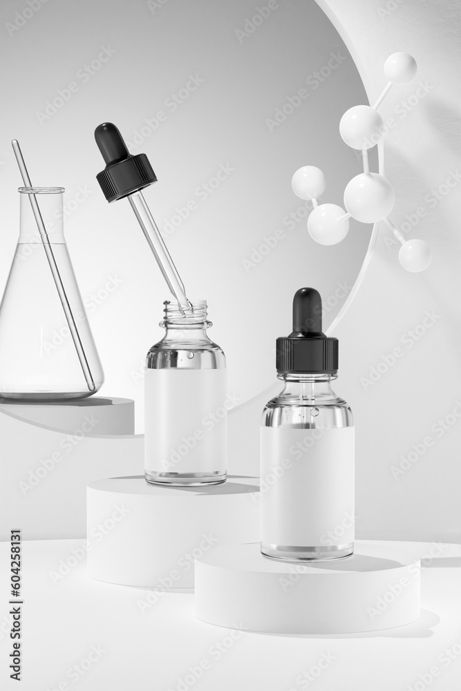 Transparent liquid contained inside two dropper bottle without label ...