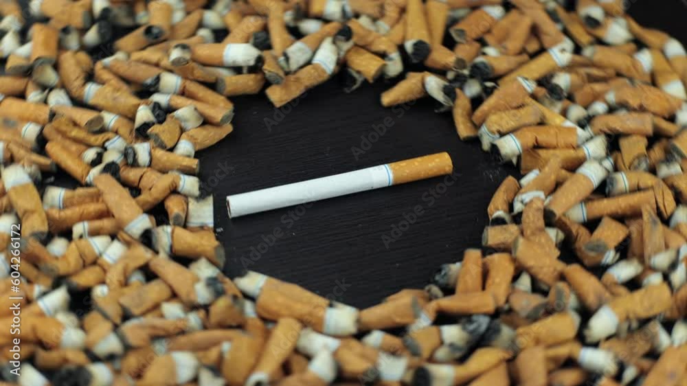 Many smoked cigarettes. Environmental pollution. Smoking harms health ...