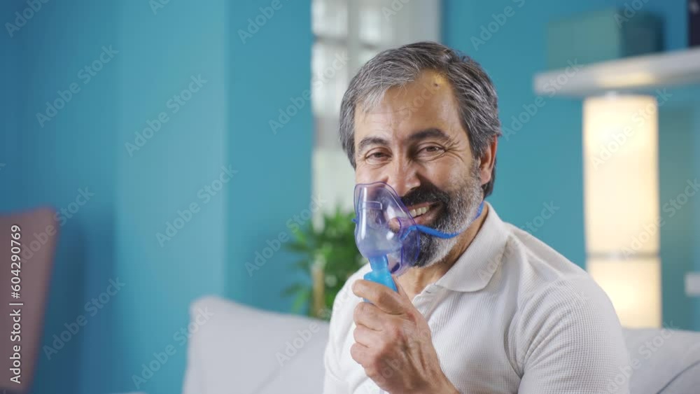 Old man with COPD takes off his ventilator and laughs at the camera ...