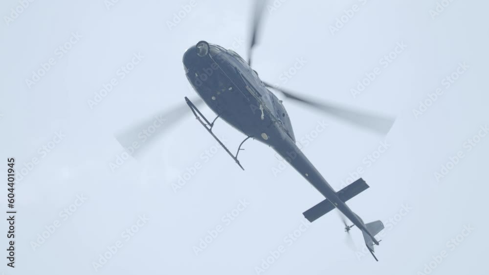Helicopter flying in the sky low angle shot footage. Helicopter in ...