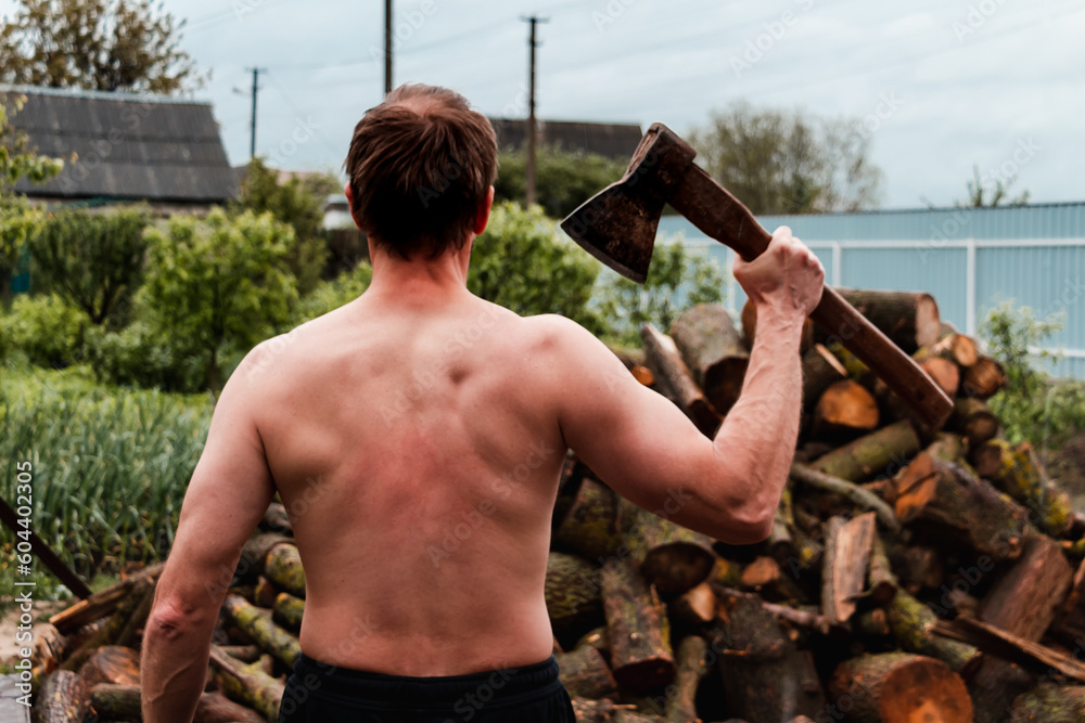 Woodcutter or lumberjack with the axe with wooden handle. The hatchet ...