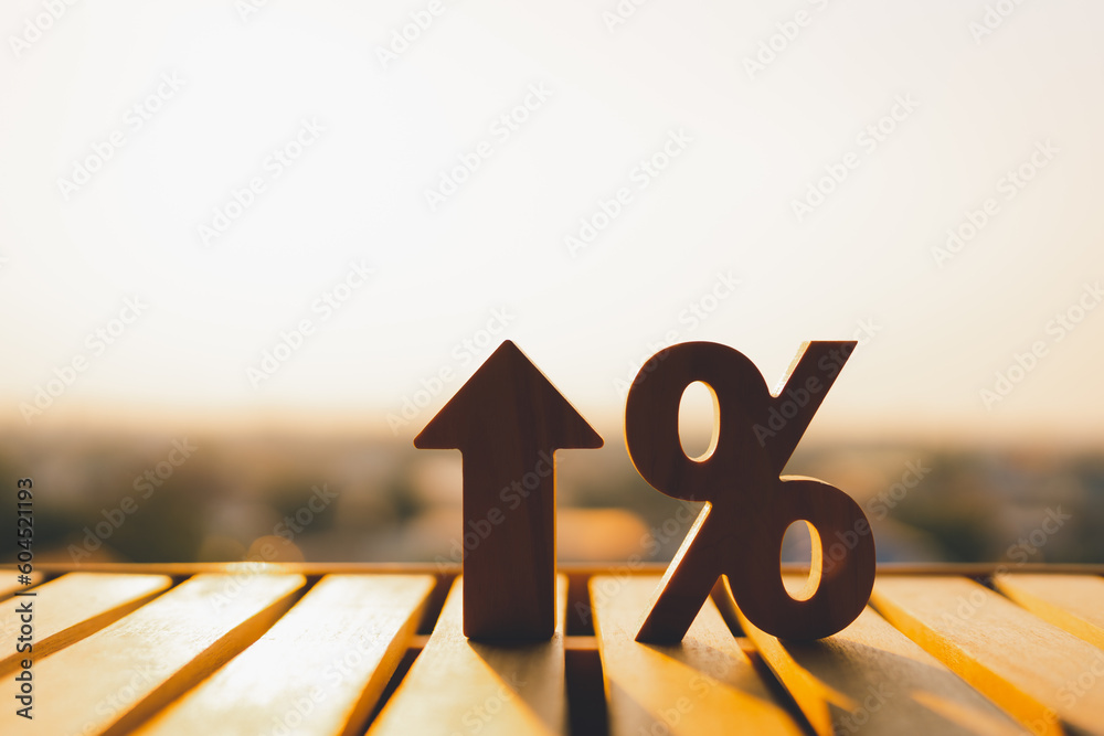 Silhouette of percentage model and up arrow with evening sky Key ...