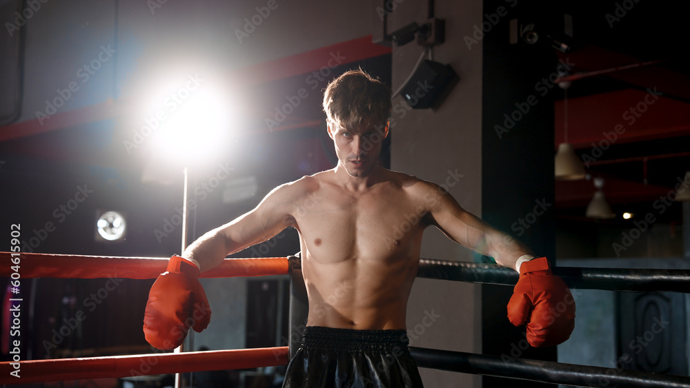 Young athlete who specializes in boxing, leaning against long string on ...
