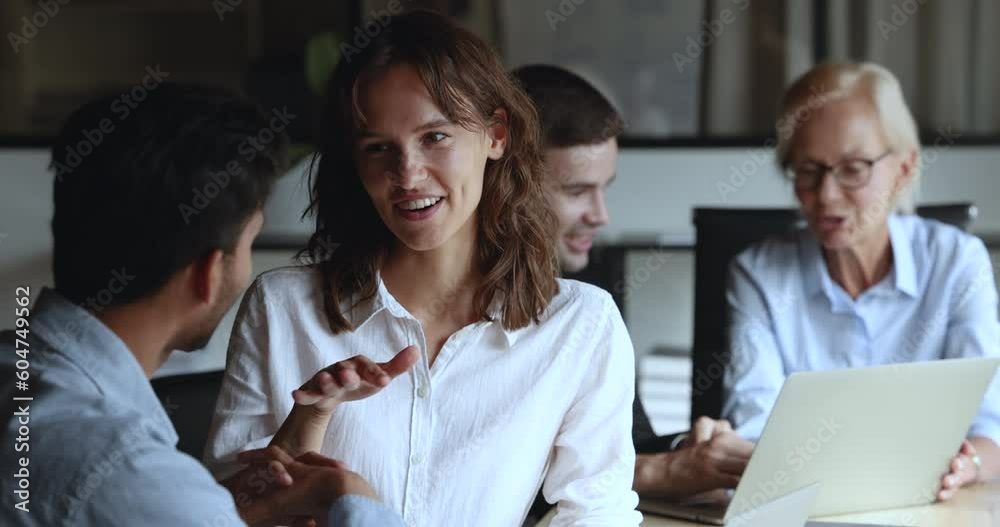 Two attractive millennial coworkers working in office, develop strategy ...