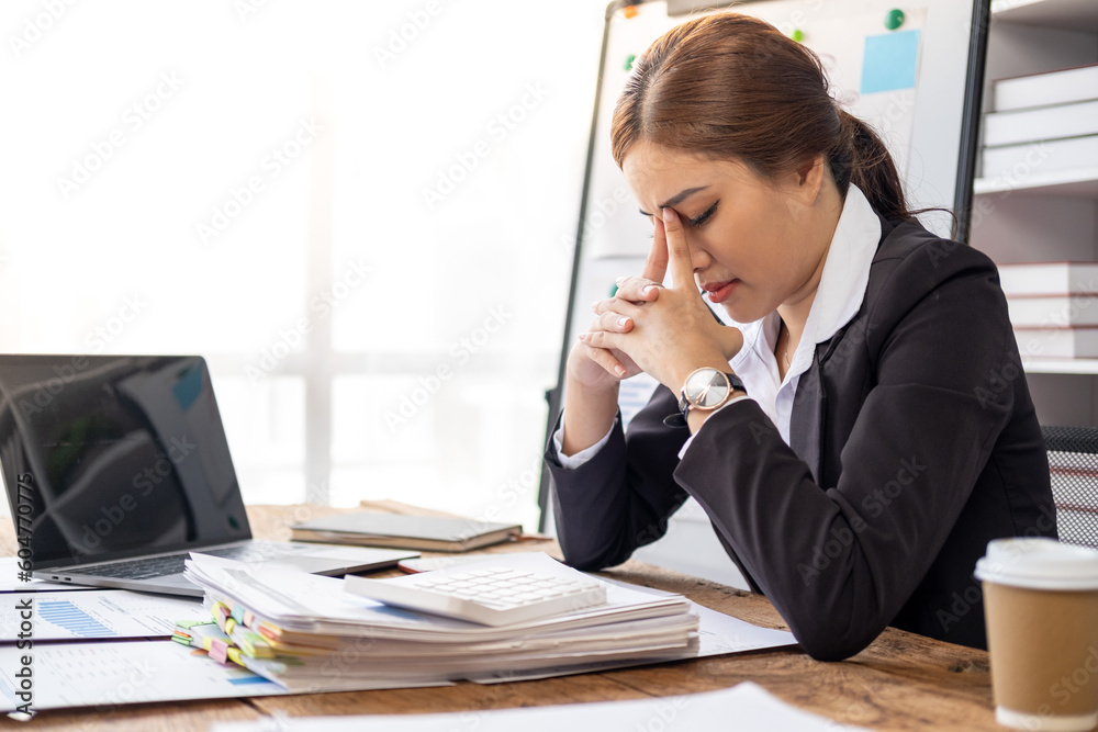 Tired Young Asian businesswoman with headache Serius stressed concern ...