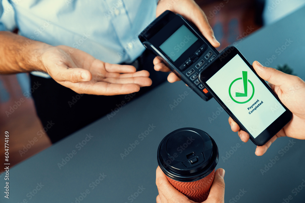 Hand holding smartphone with NFC QR code device, scanning contactless ...