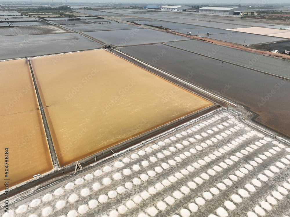 Aerial top view sea salt farm. Pile of brine salt. Raw material of salt ...