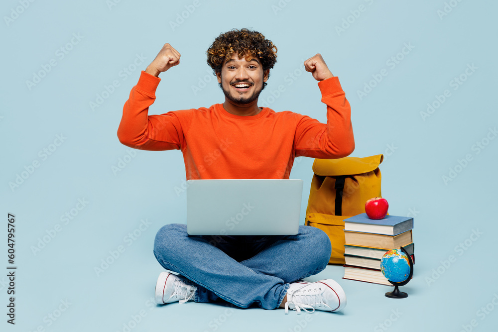 Full body young teen Indian boy student wear casual clothes sit near ...