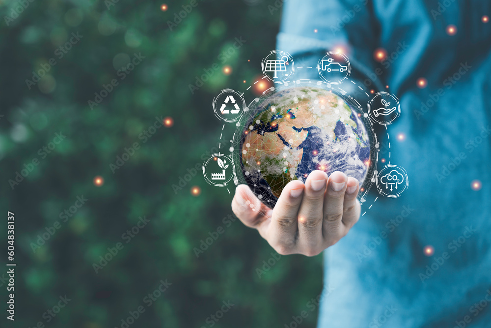 Hand holding virtual world with CO2 reducing ,Recycle ,green factory icon on nature for decrease ...
