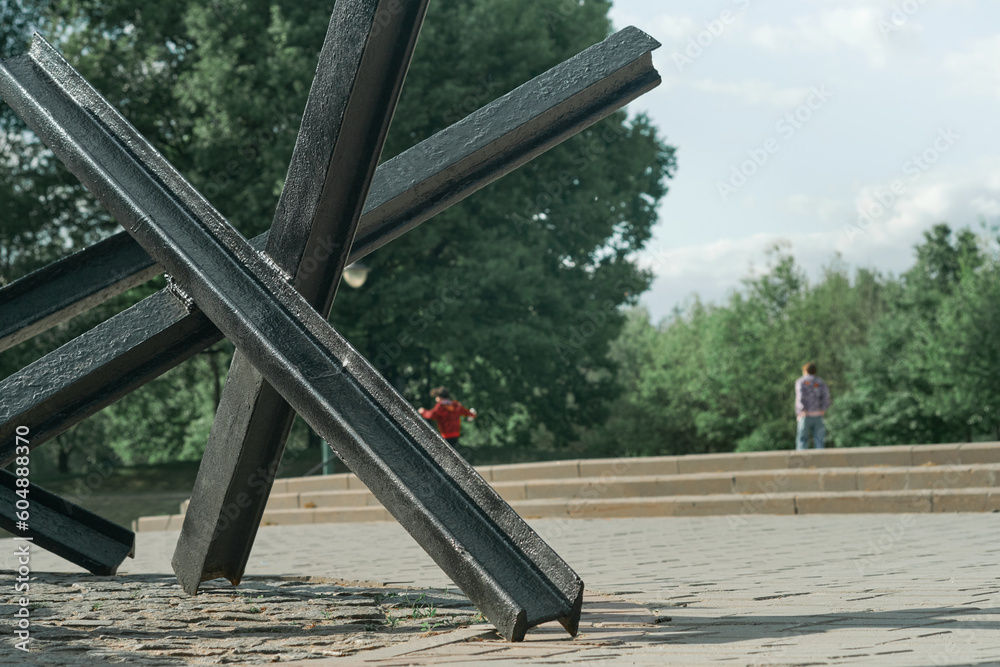 Anti-tank hedgehogs and tank closeup and peaceful background. Monument ...