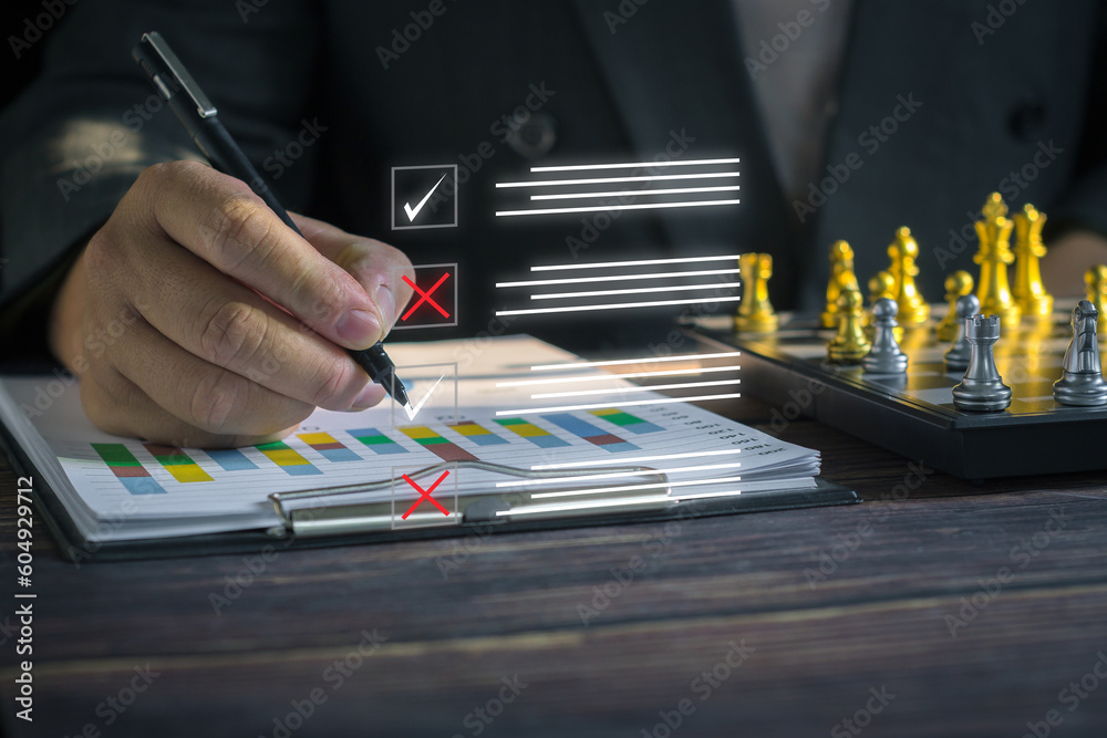 Checklist concept. Hands are holding on. Check mark on wooden block ...