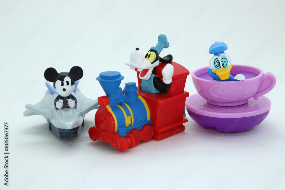 Mickey Mouse, Goofy and Donald Duck in the attractions of the ...