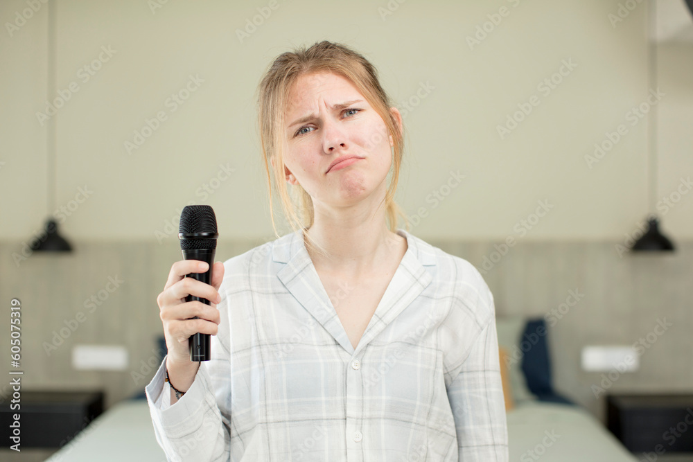 young pretty woman feeling sad and whiney with an unhappy look and ...