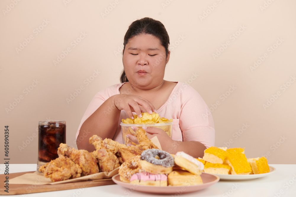 obesity young women binge eating disorder concept with woman eating ...