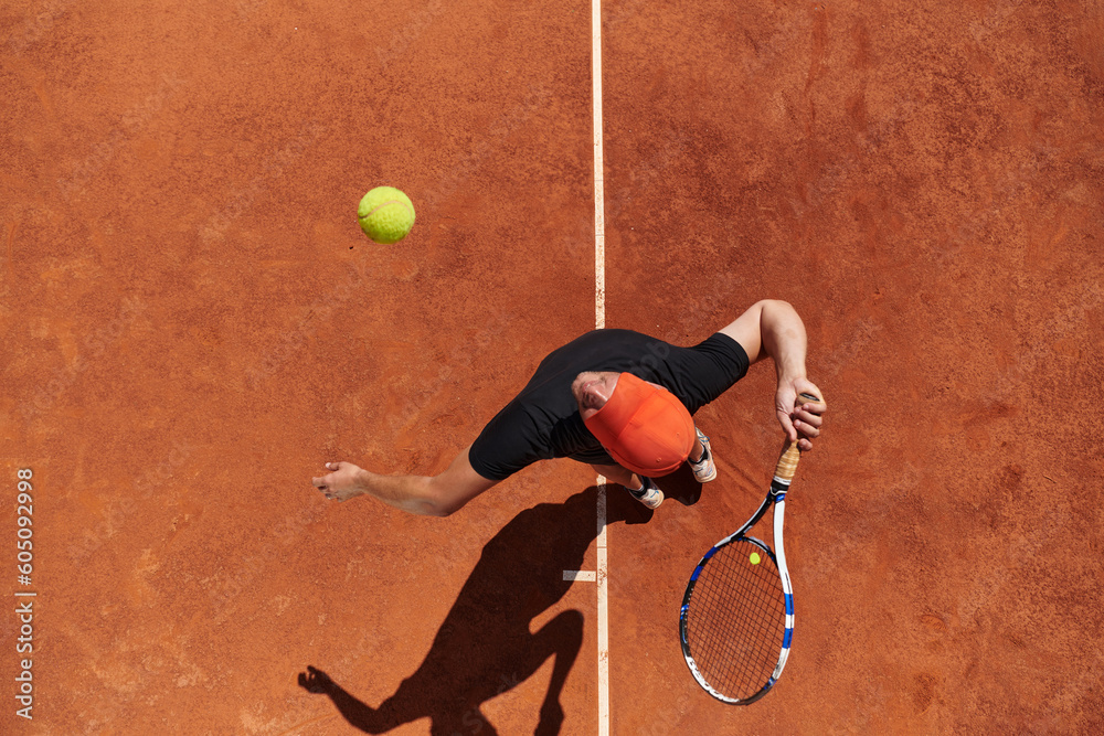 Top view of a professional tennis player serves the tennis ball on the ...