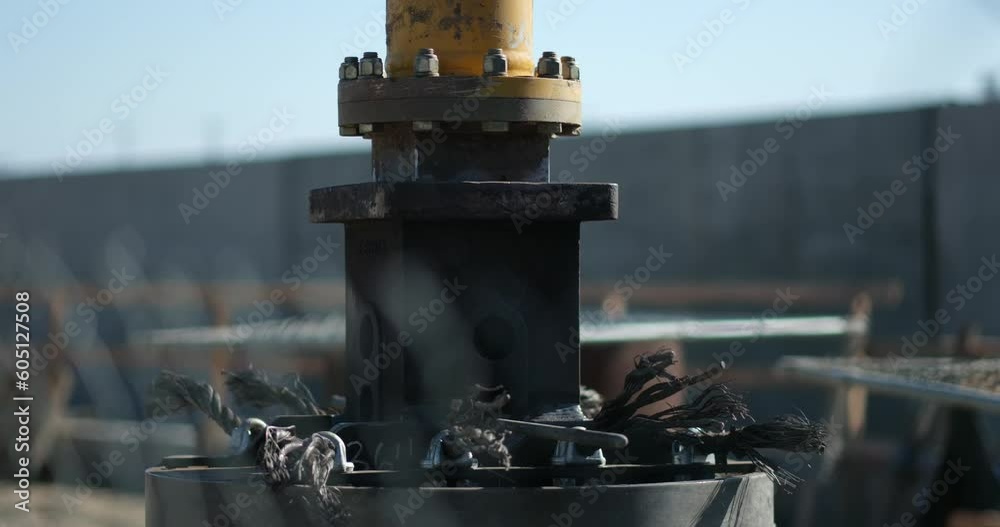 A heavy duty drilling rig is set up at a construction site, ready to ...
