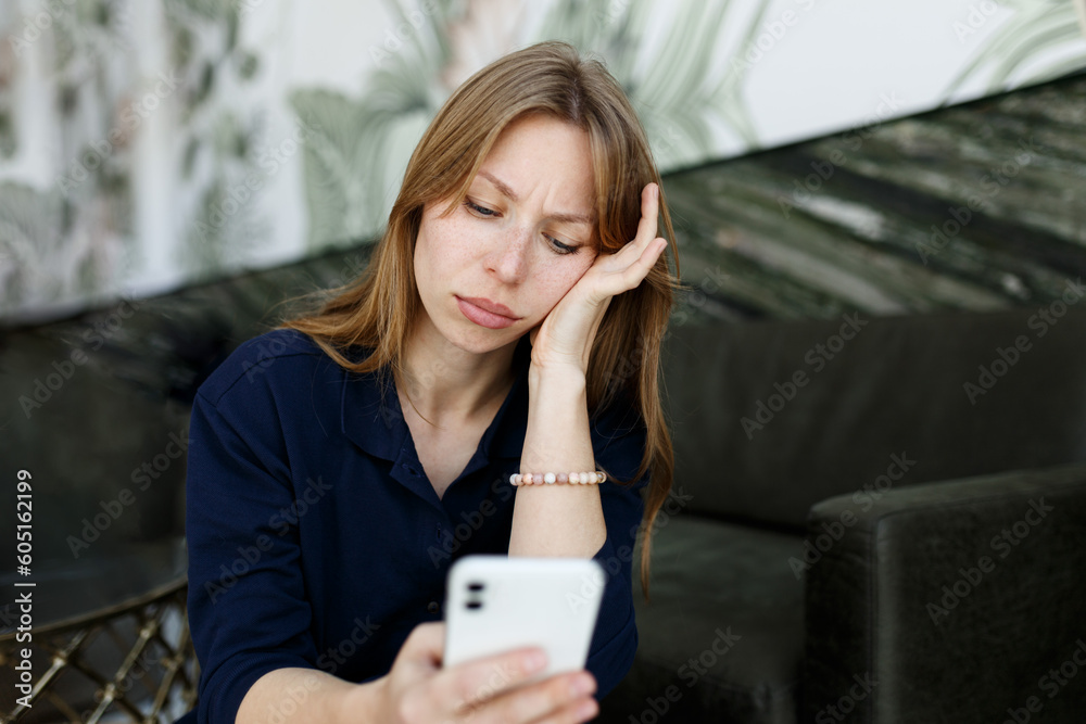 Young woman sad,reading bad news email, break up message from ex ...
